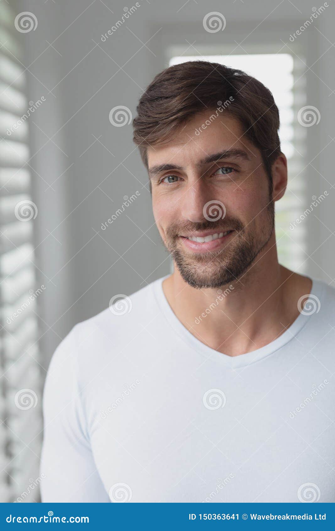 Man smiling at home stock image. Image of clothing, home - 150363641