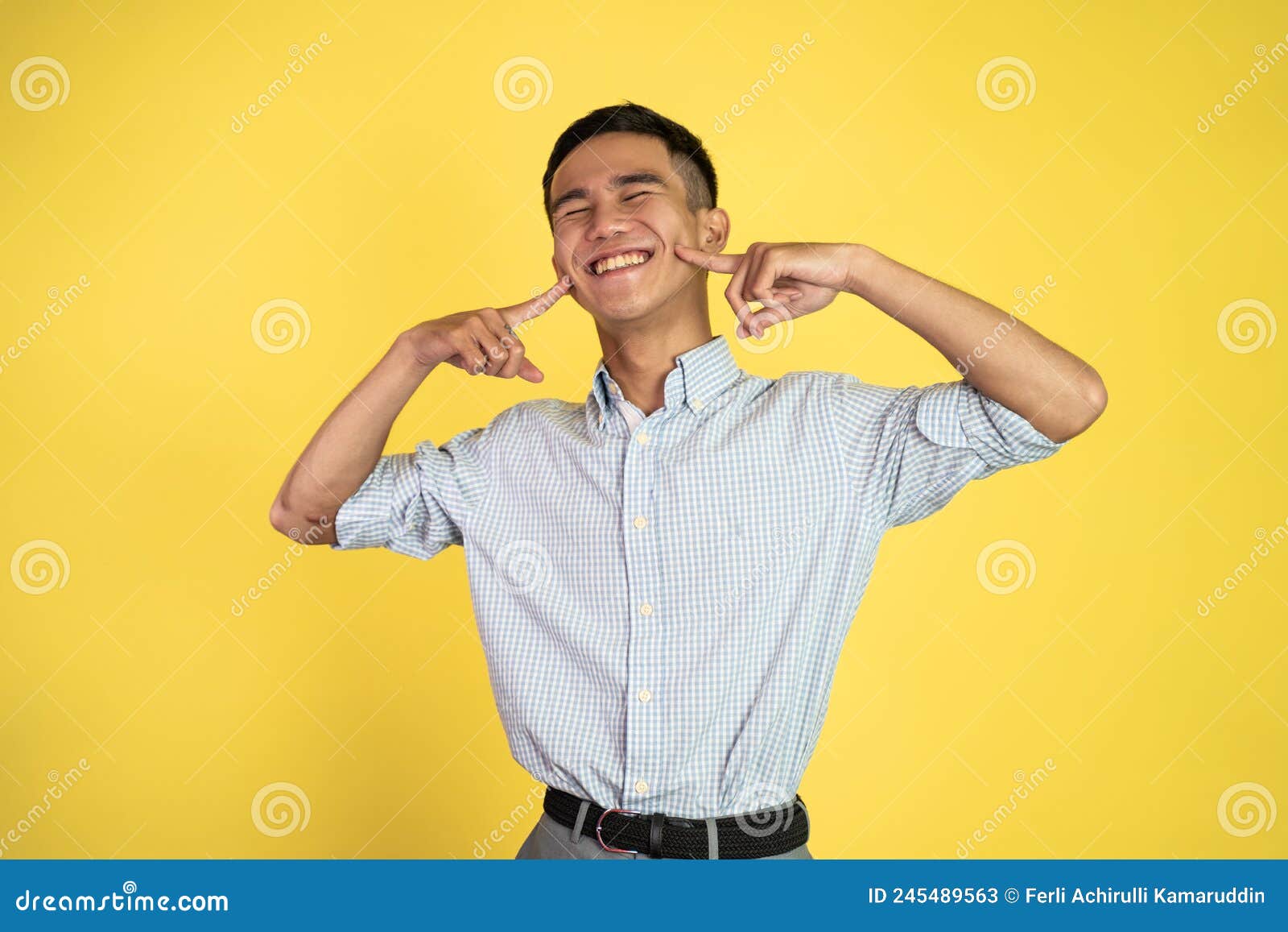 Man Smiling and Making a Cute Gesture Put His Finger in the Cheeks ...