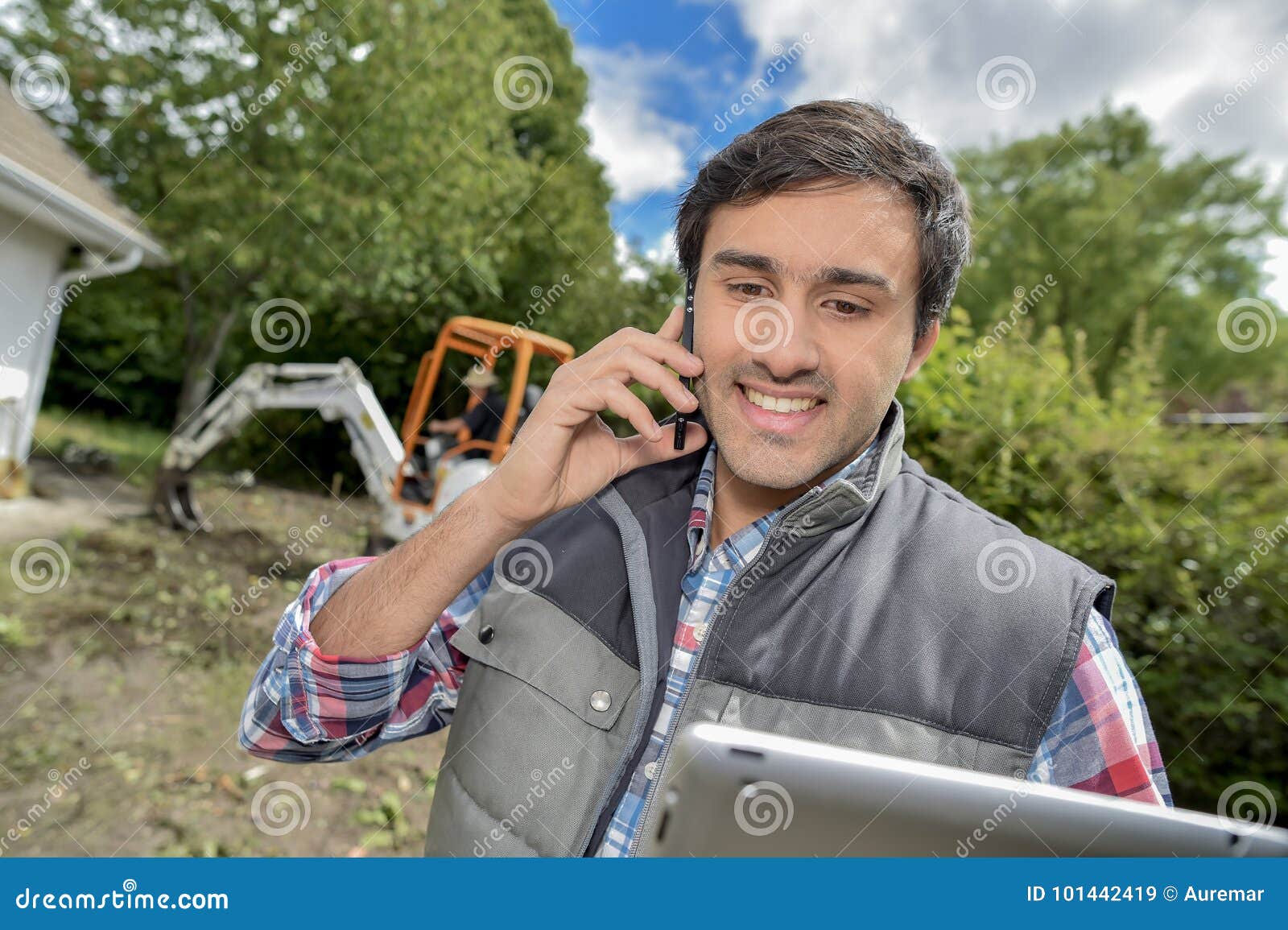 Man Smiling on Phone on Construction Site Stock Image - Image of people ...