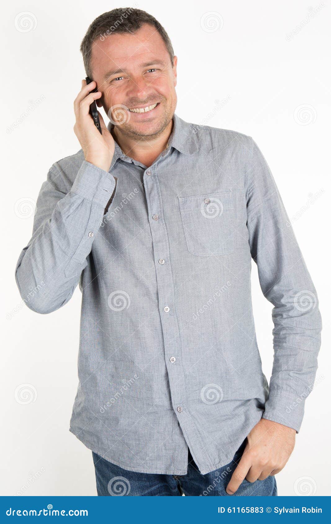 Man smiling on phone stock image. Image of grey, handsome - 61165883