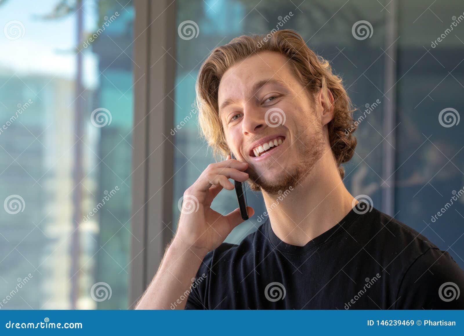 Man Smiling while Talking on Cell Phone Stock Image - Image of ...