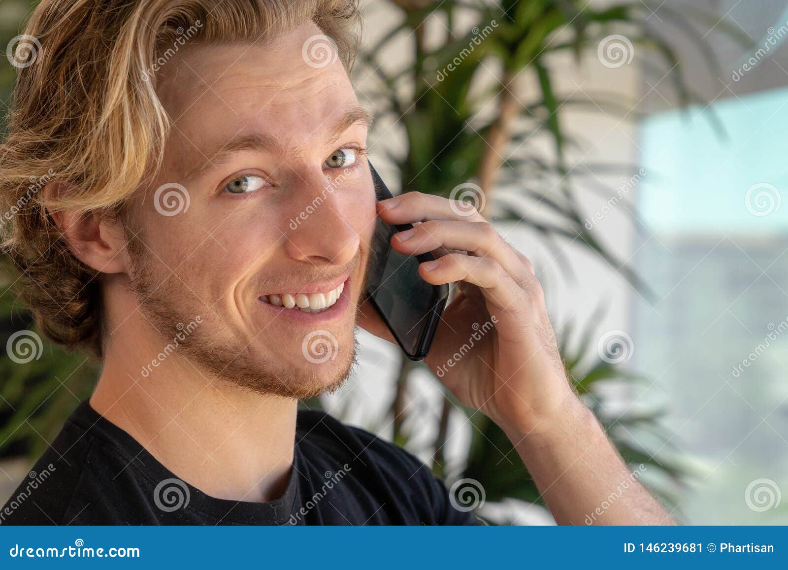 Man Smiling while Talking on Cell Phone Stock Image - Image of ...