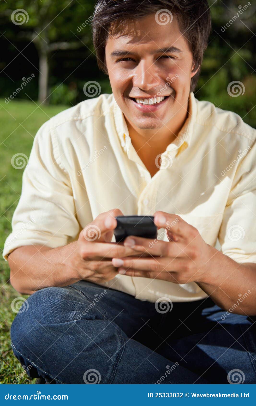 Man Smiling while Writing a Text Message Stock Photo - Image of ...