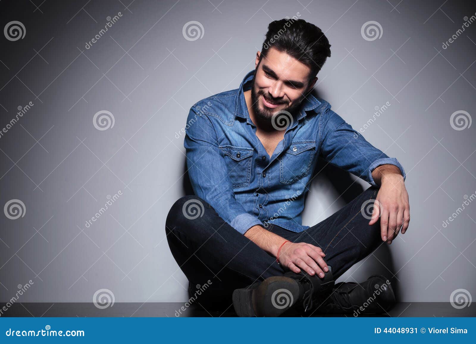Man smilling and sitting stock image. Image of background - 44048931