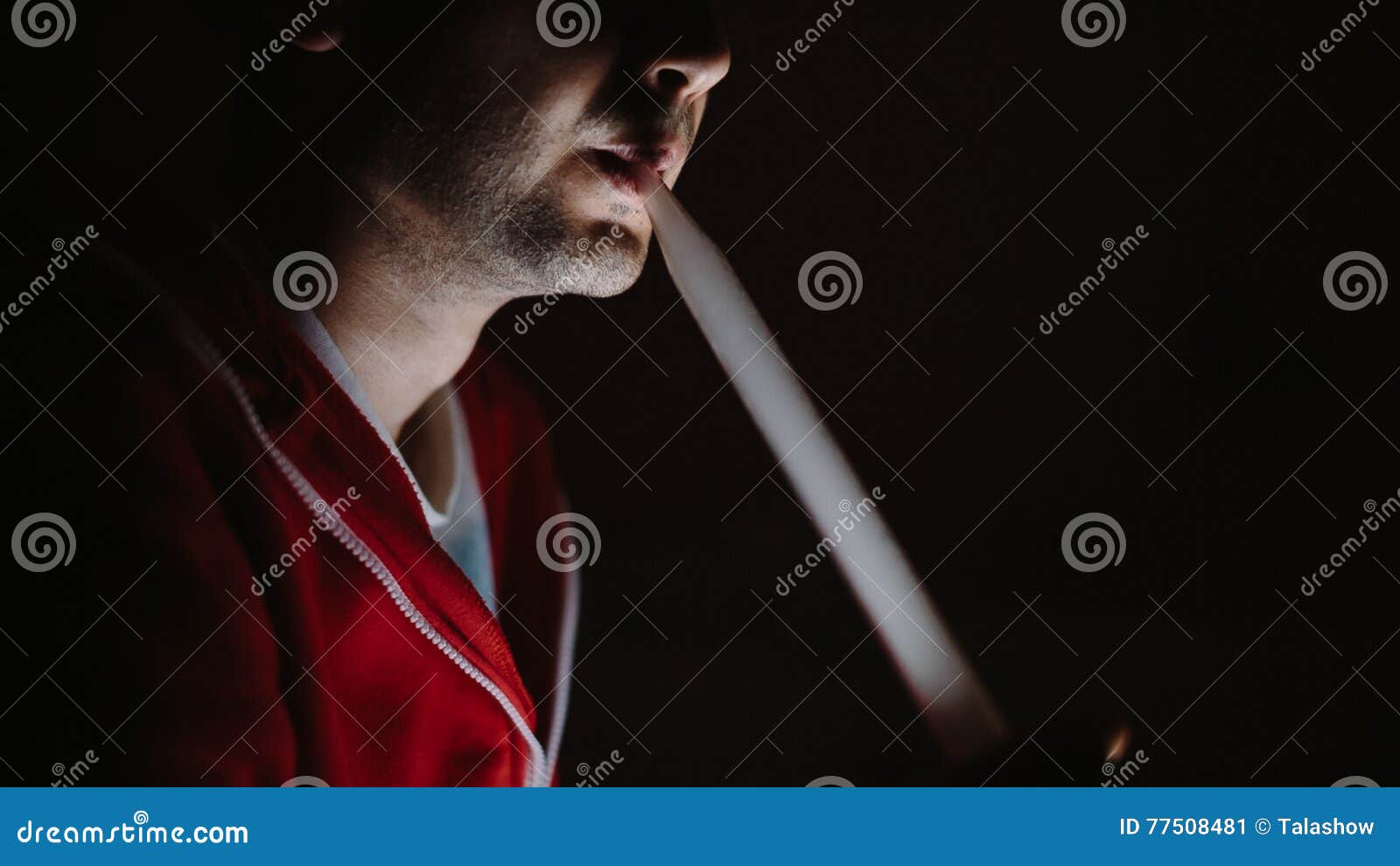Man smokes in the dark stock image. Image of spirit, curve - 77508481
