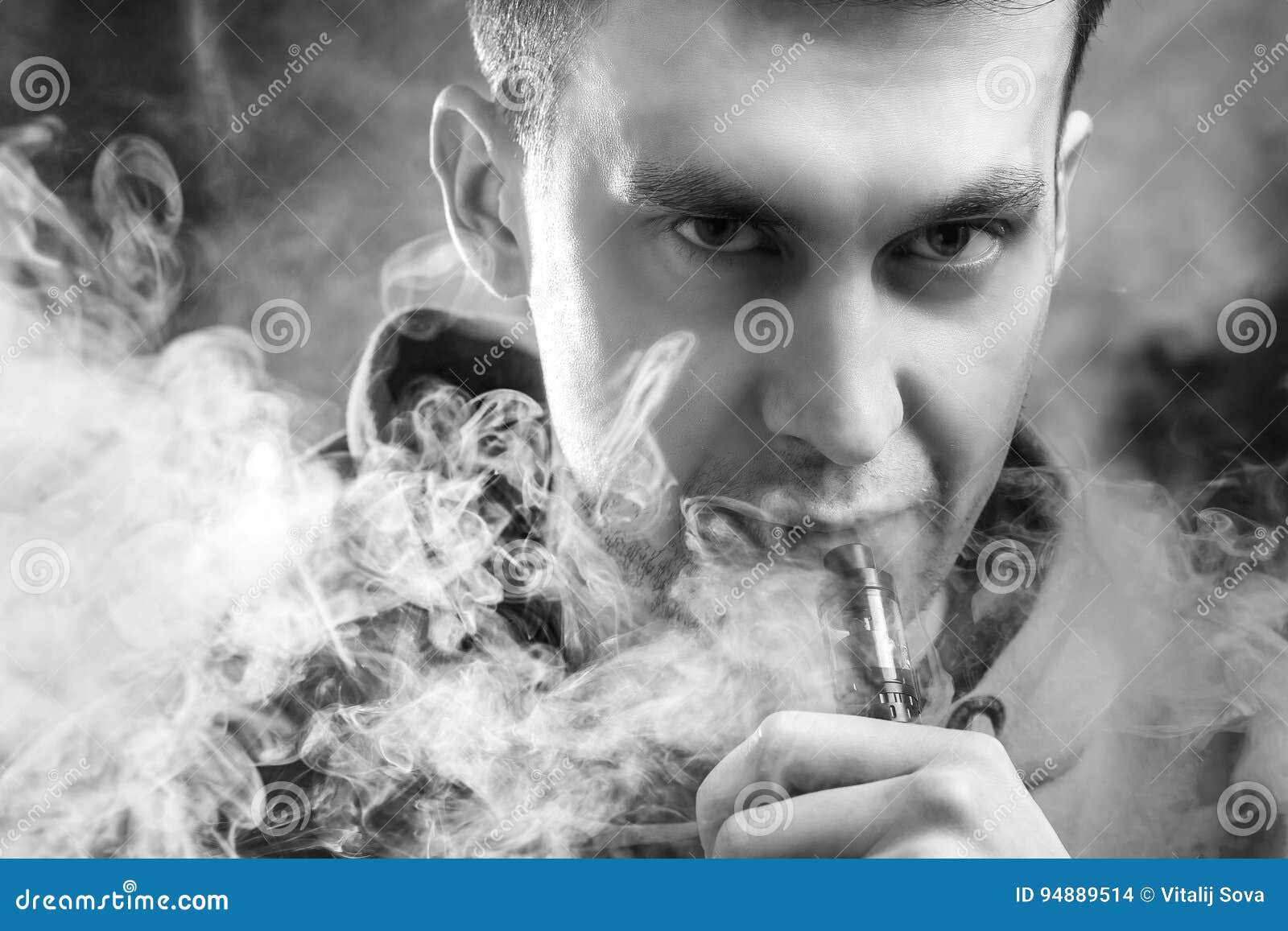 Man smokes a vape stock photo. Image of vaping, vapor - 94889514