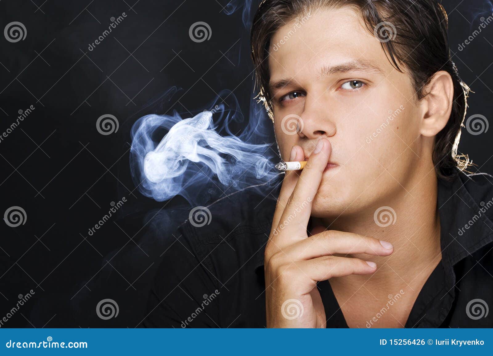Man smoking a cigarette stock photo. Image of head, background - 15256426