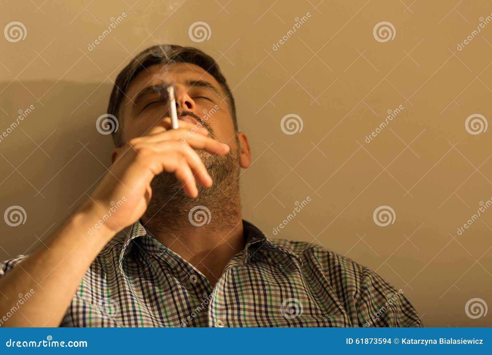 Man smoking a cigarette stock photo. Image of desolation - 61873594