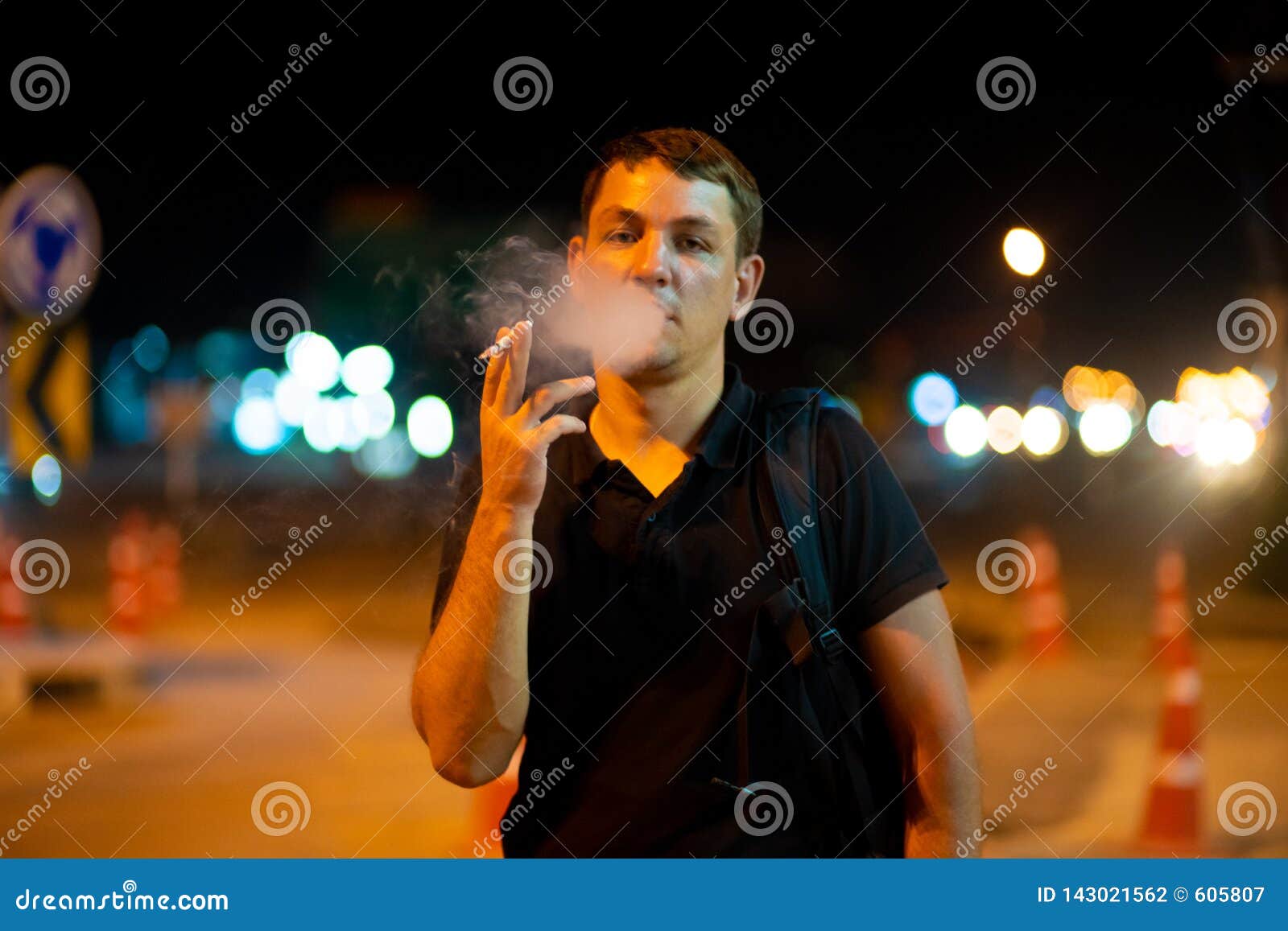 Man Smoking a Cigarette on the Street at Night. Stock Photo - Image of ...