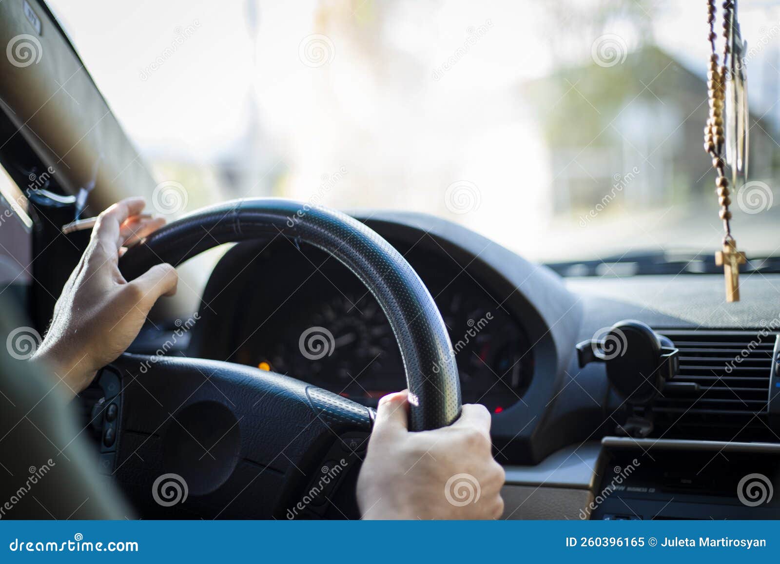 Man smoking while driving stock image. Image of people - 260396165