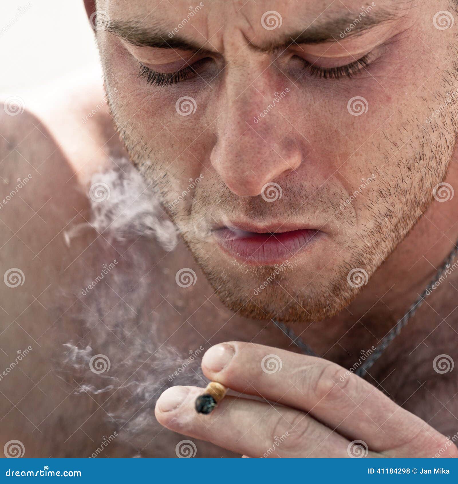 Man smoking hashish joint stock photo. Image of dope - 41184298