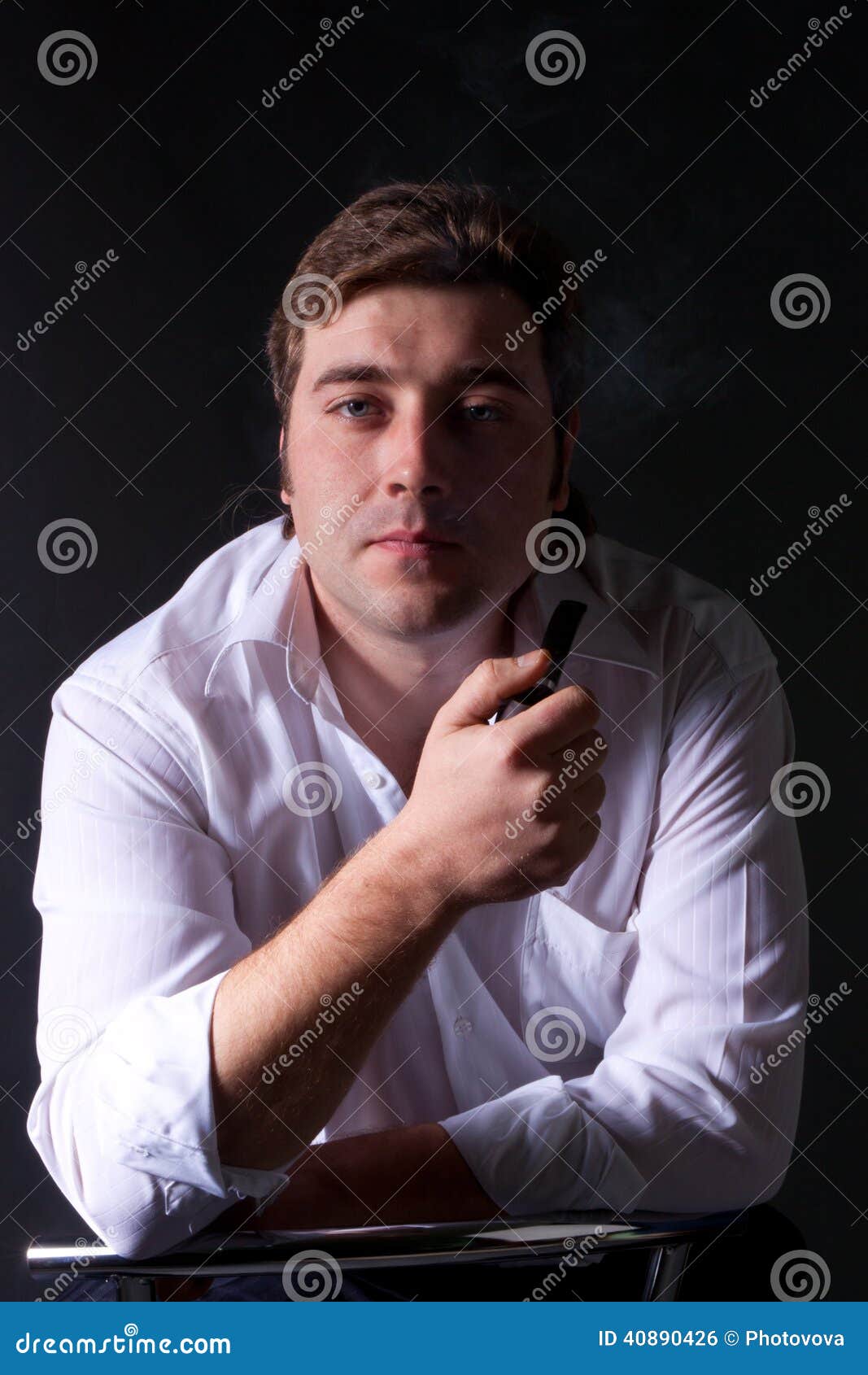 Man smoking a pipe stock photo. Image of brown, grey - 40890426
