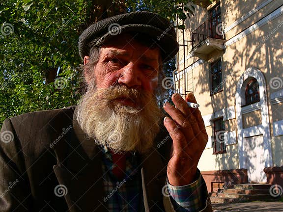 Man smoking in the street stock photo. Image of hand, poverty - 2991304