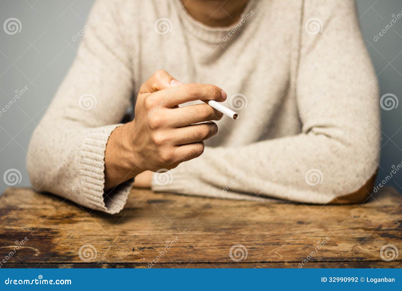 Man smoking at table stock photo. Image of young, focus - 32990992