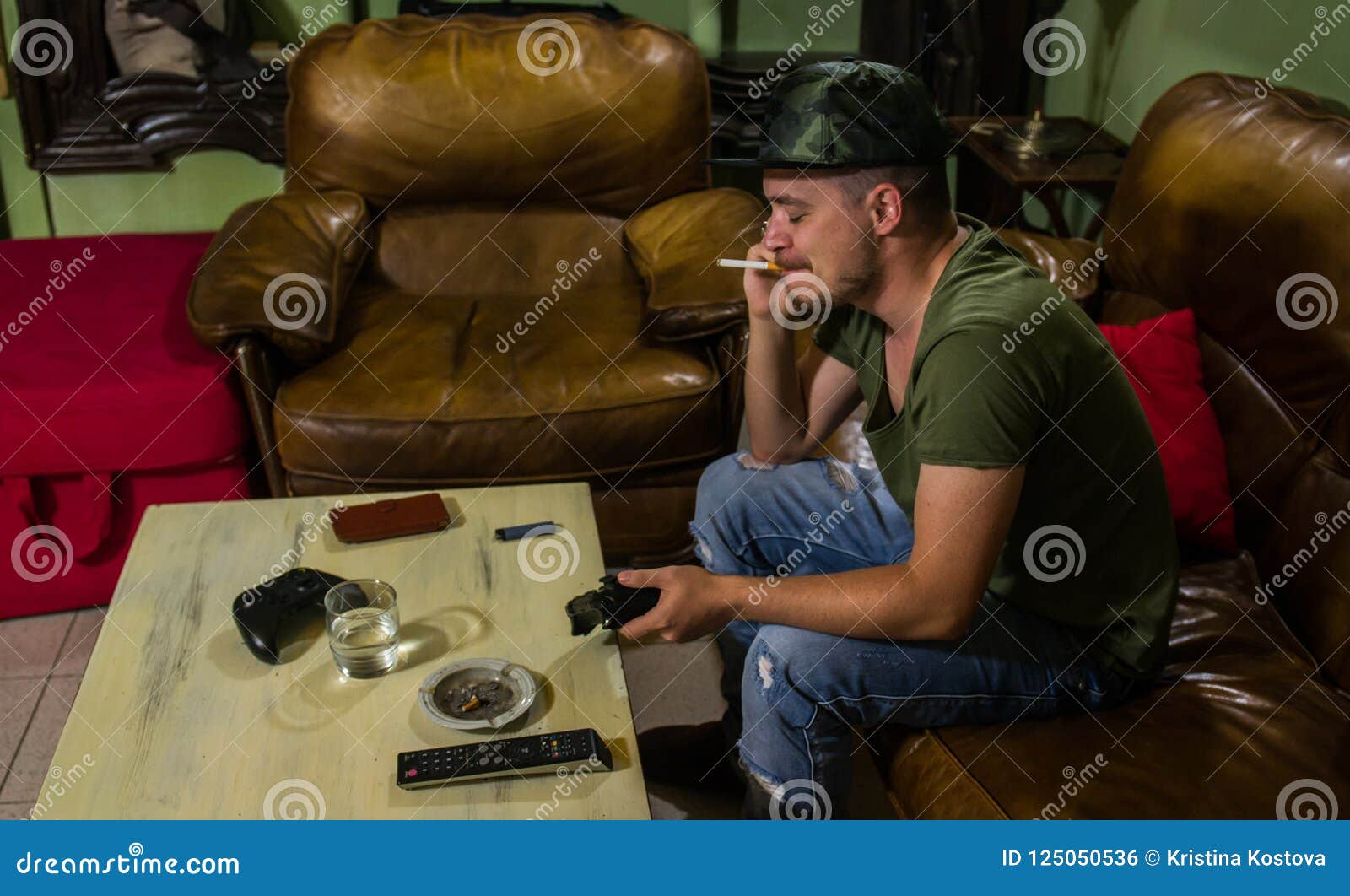 A Man is Smoking and Talking on the Phone Stock Photo - Image of ...