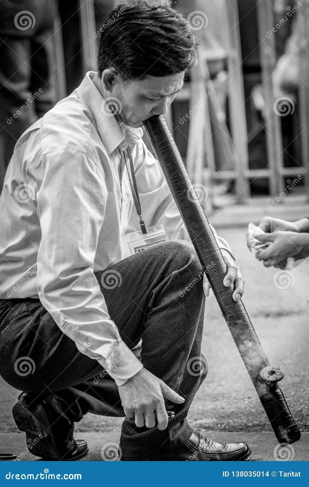 Vietnamese Man Smoking a Typical Bamboo Water Pipe at the Streets of ...