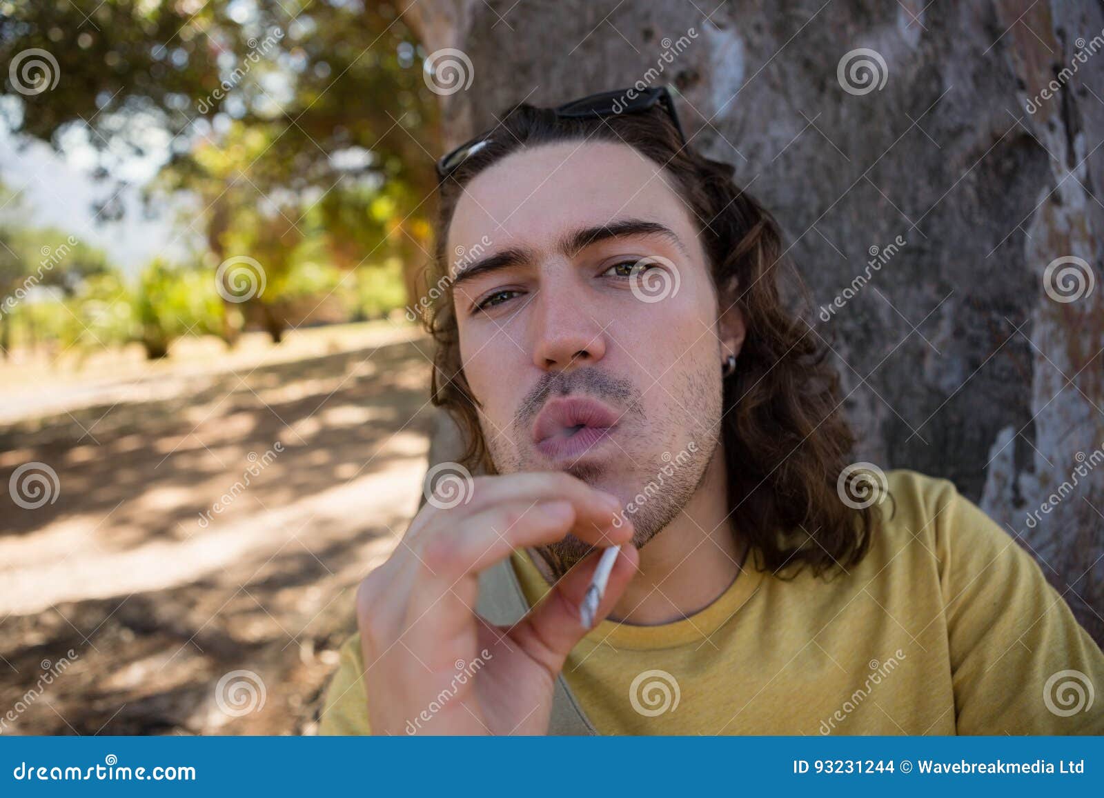 Man Smoking Weed in the Park Stock Photo - Image of summertime, people ...