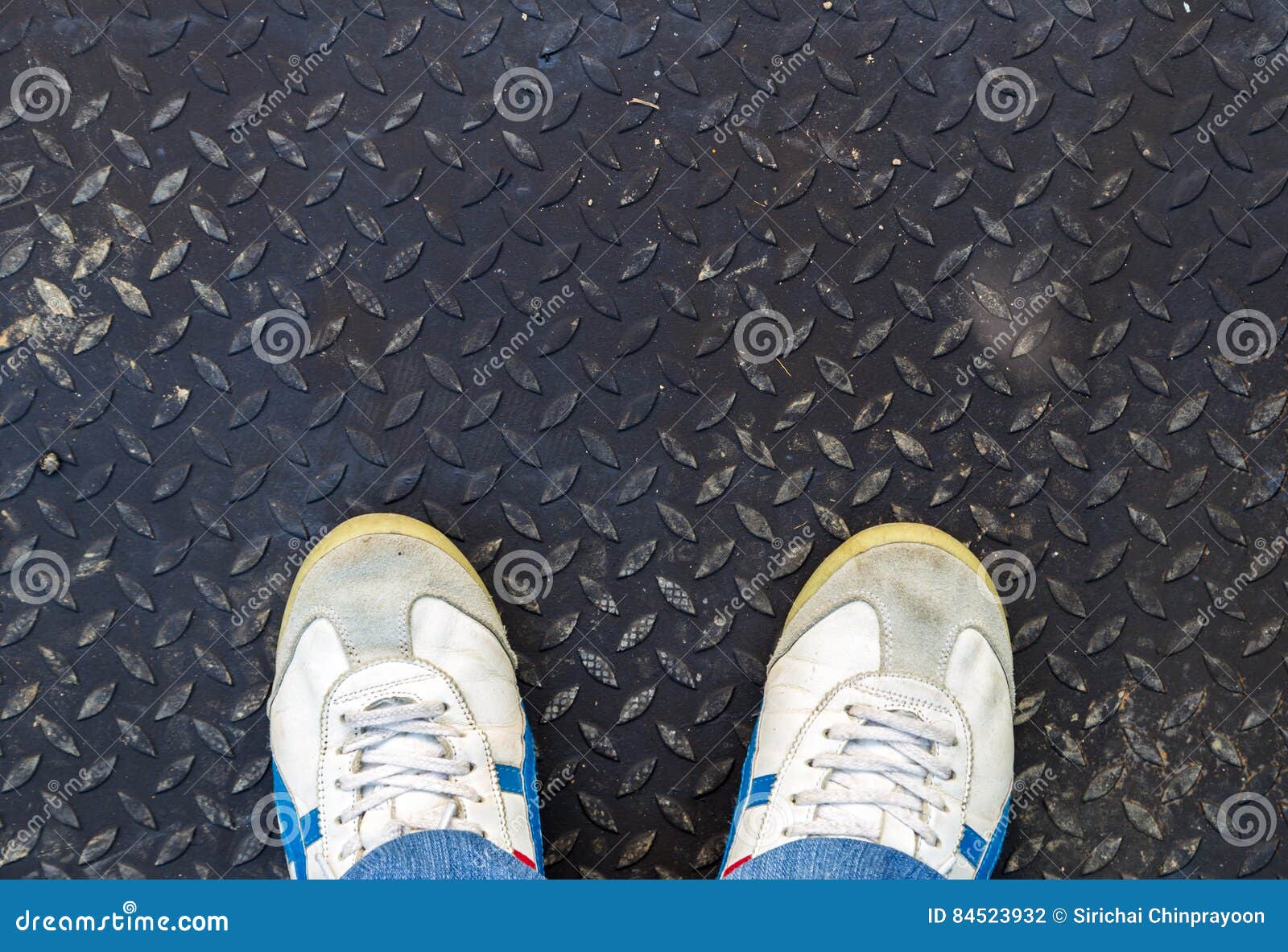 Man Sneaker on Metal Diamond Grip Floor Stock Photo - Image of couple ...