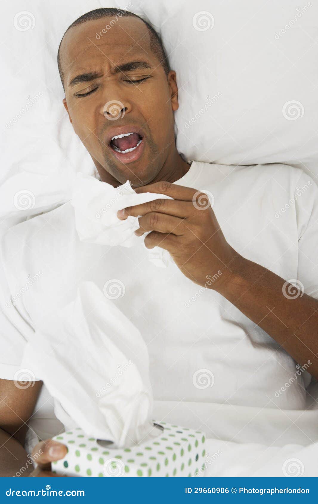Man Sneezing in Bed stock photo. Image of irritation - 29660906