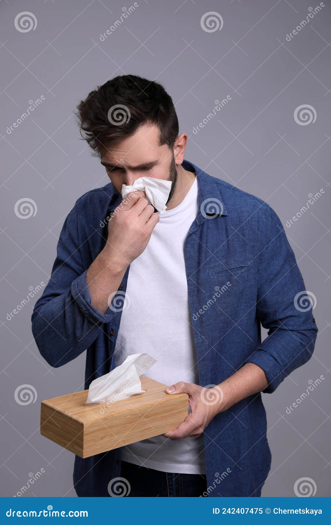 Man Sneezing on Grey Background. Cold Symptoms Stock Image - Image of ...