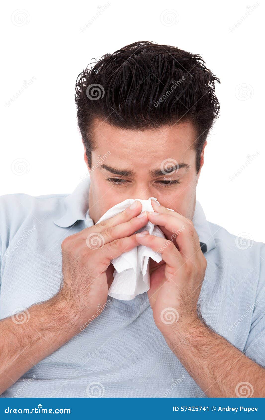 Man Sneezing Into A Tissue Stock Photo - Image: 57425741