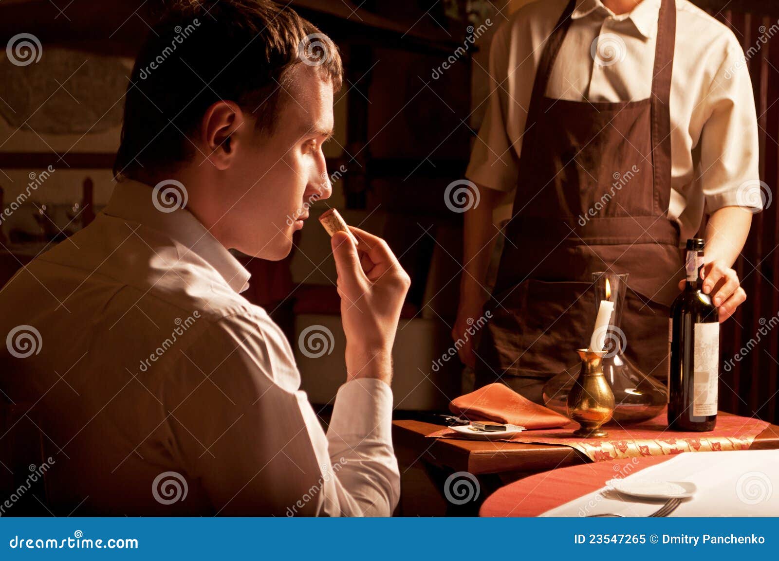 Man Sniffing the Cork of a Wine Stock Image - Image of drink, candle ...