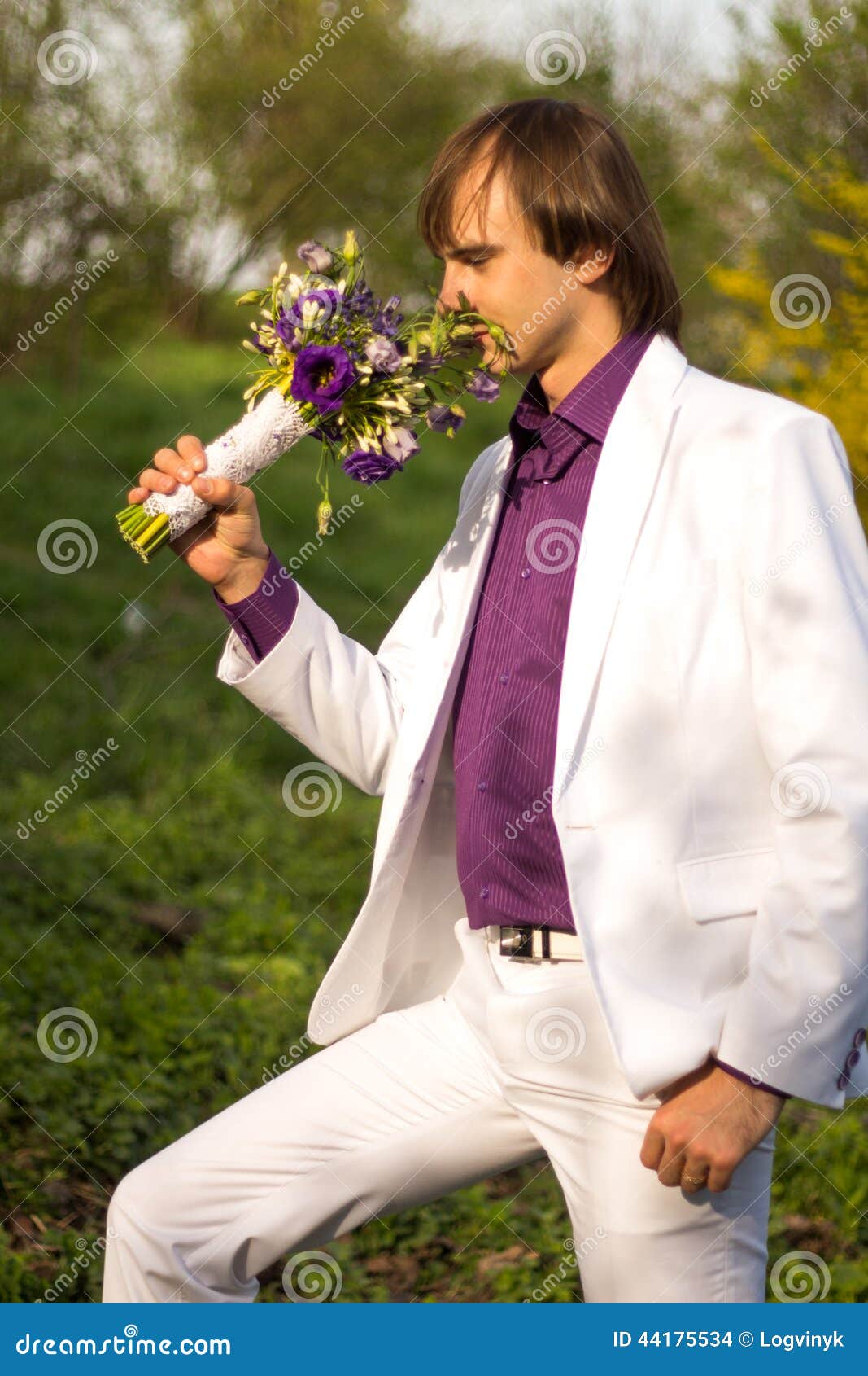 Man Sniffing a Flower stock photo. Image of wellness - 44175534