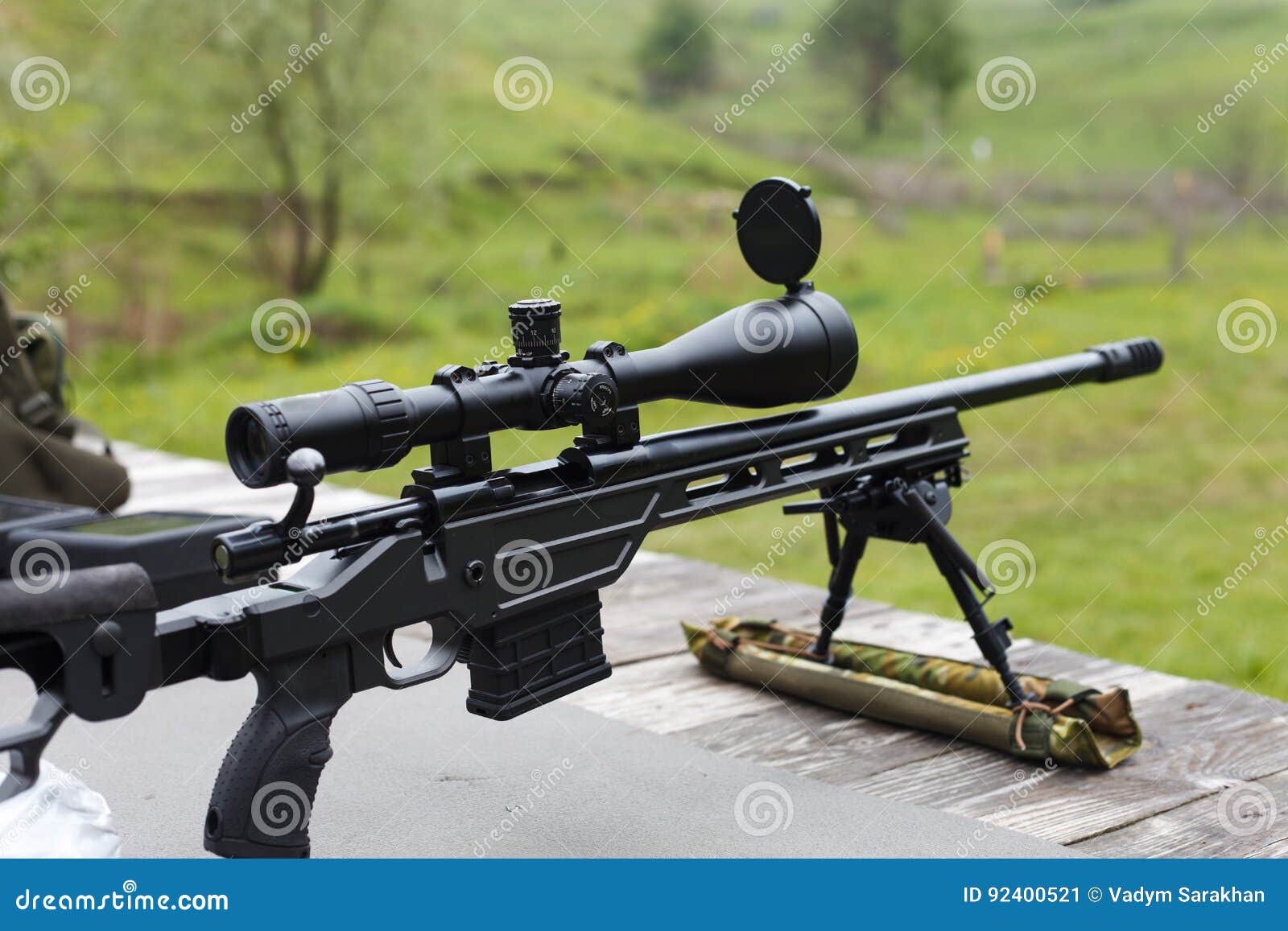 A Man Sniper Prepares To Shoot at the Target. Stock Image - Image of ...