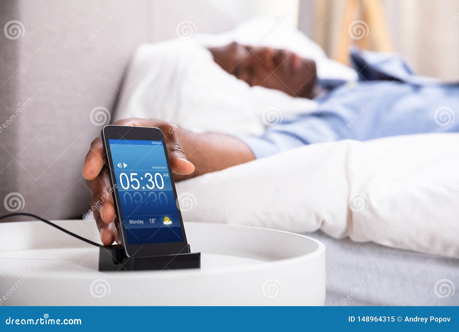 Man Snoozing Alarm on Mobile Phone Stock Image - Image of duvet ...