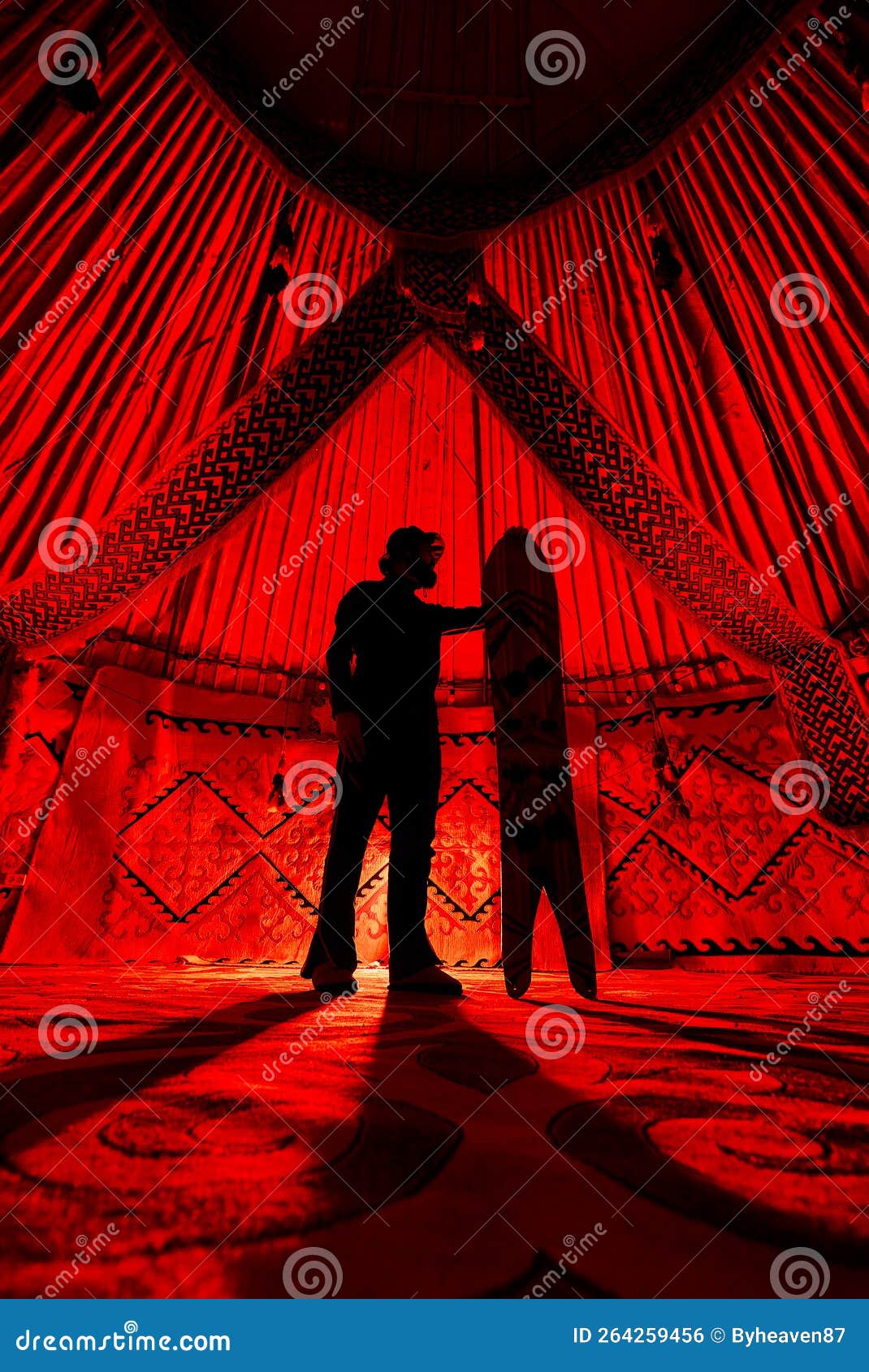 Man with Snowboard Inside Yurt Nomadic House with Red Light Stock Photo ...