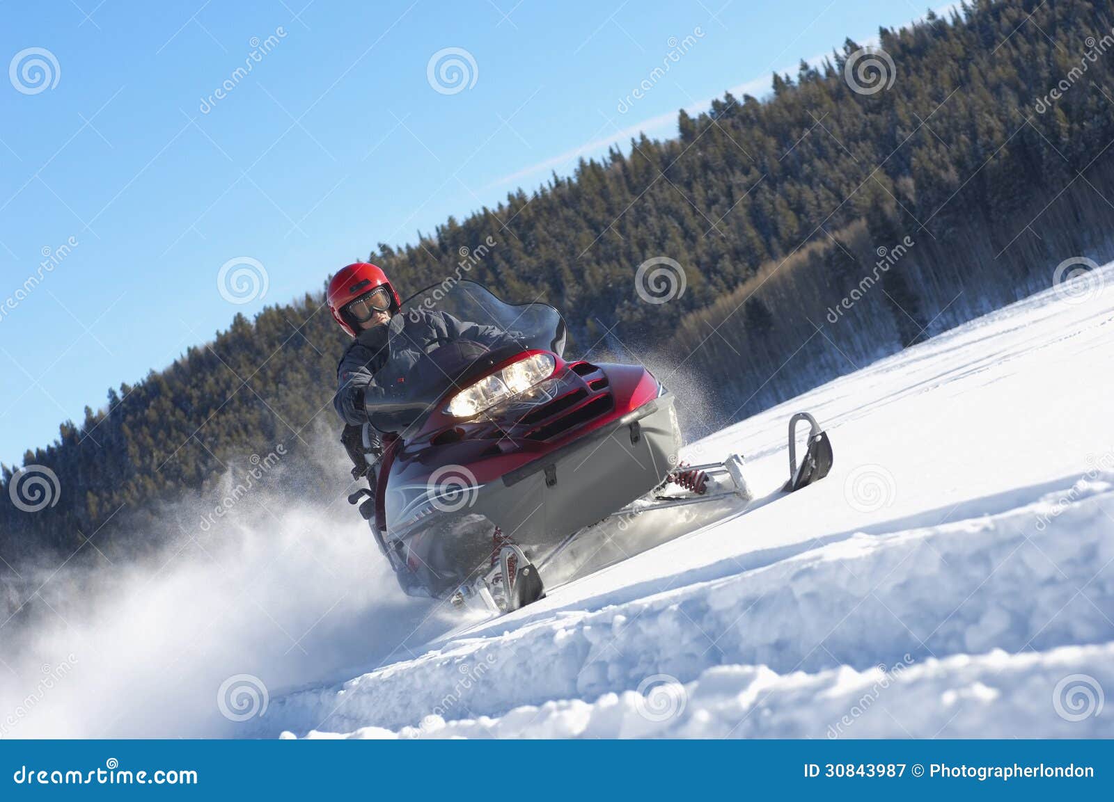 Man Snowmobiling through Snow Stock Image - Image of snowmobile ...