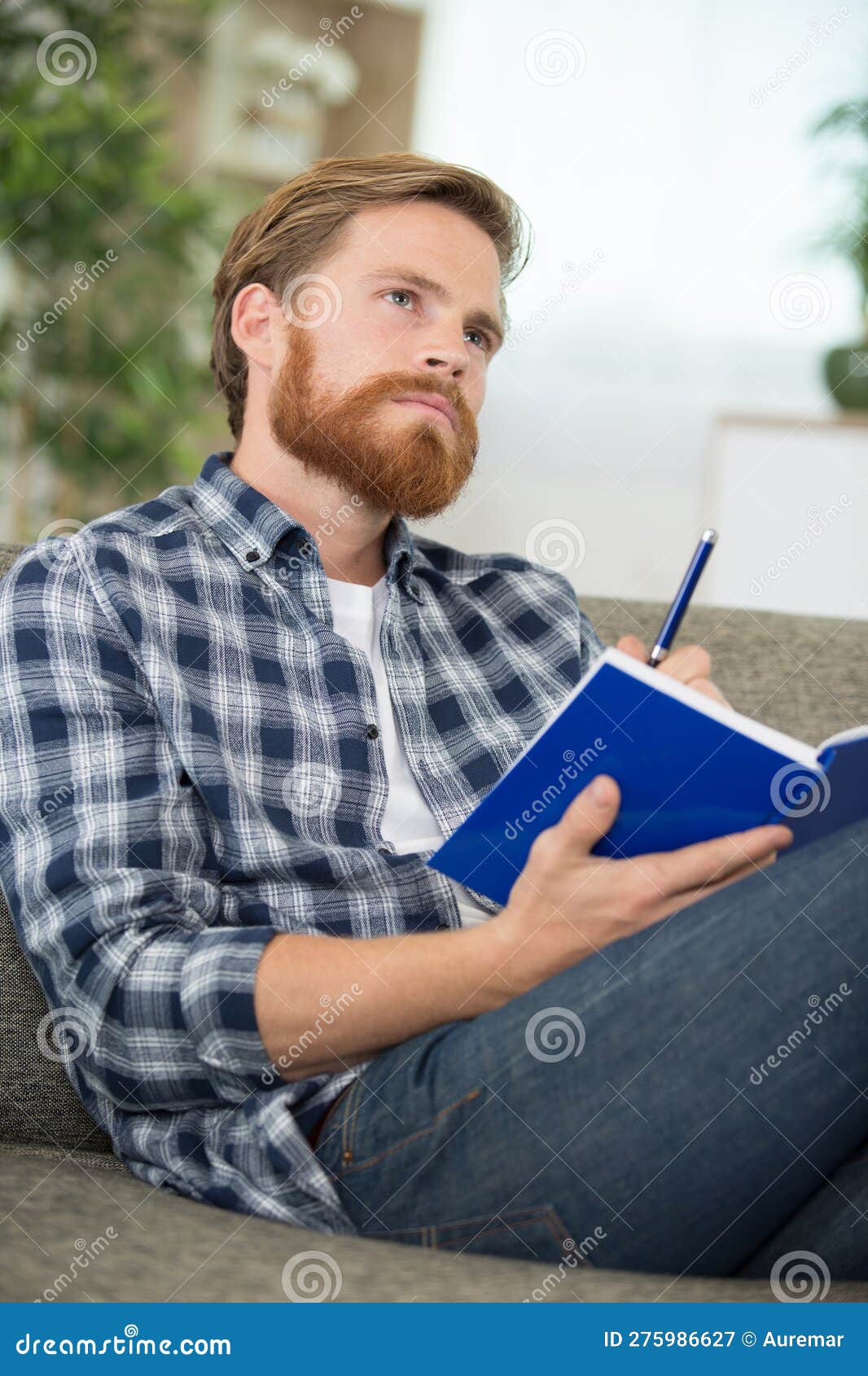 Man on sofa notes stock image. Image of concept, learn - 275986627