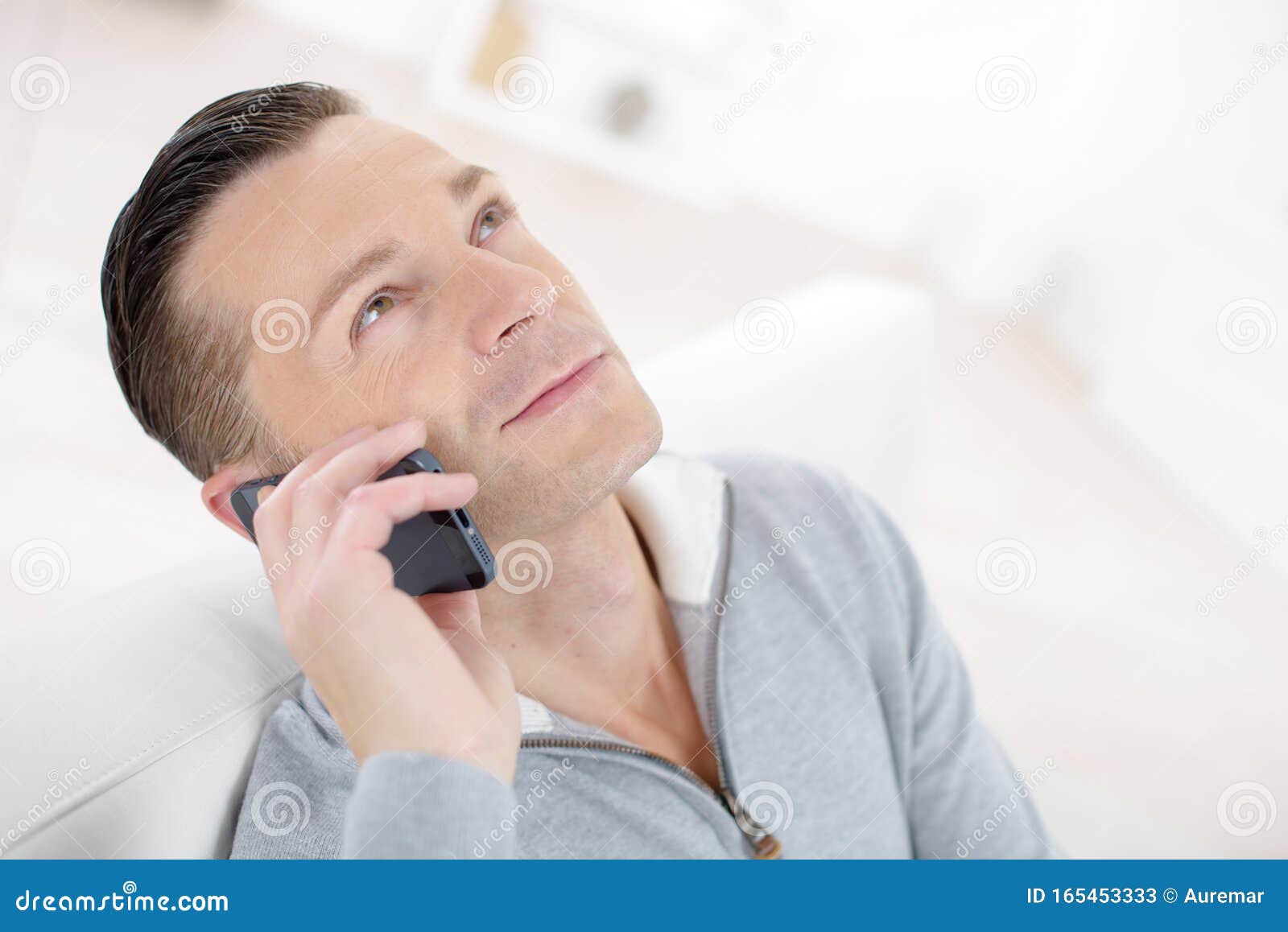 Man in Sofa Talking on Phone Stock Image - Image of phonecall, hair ...