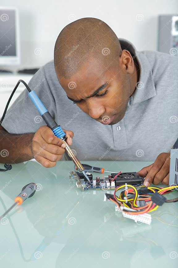 Man soldering pc stock photo. Image of reflective, hand - 276719672