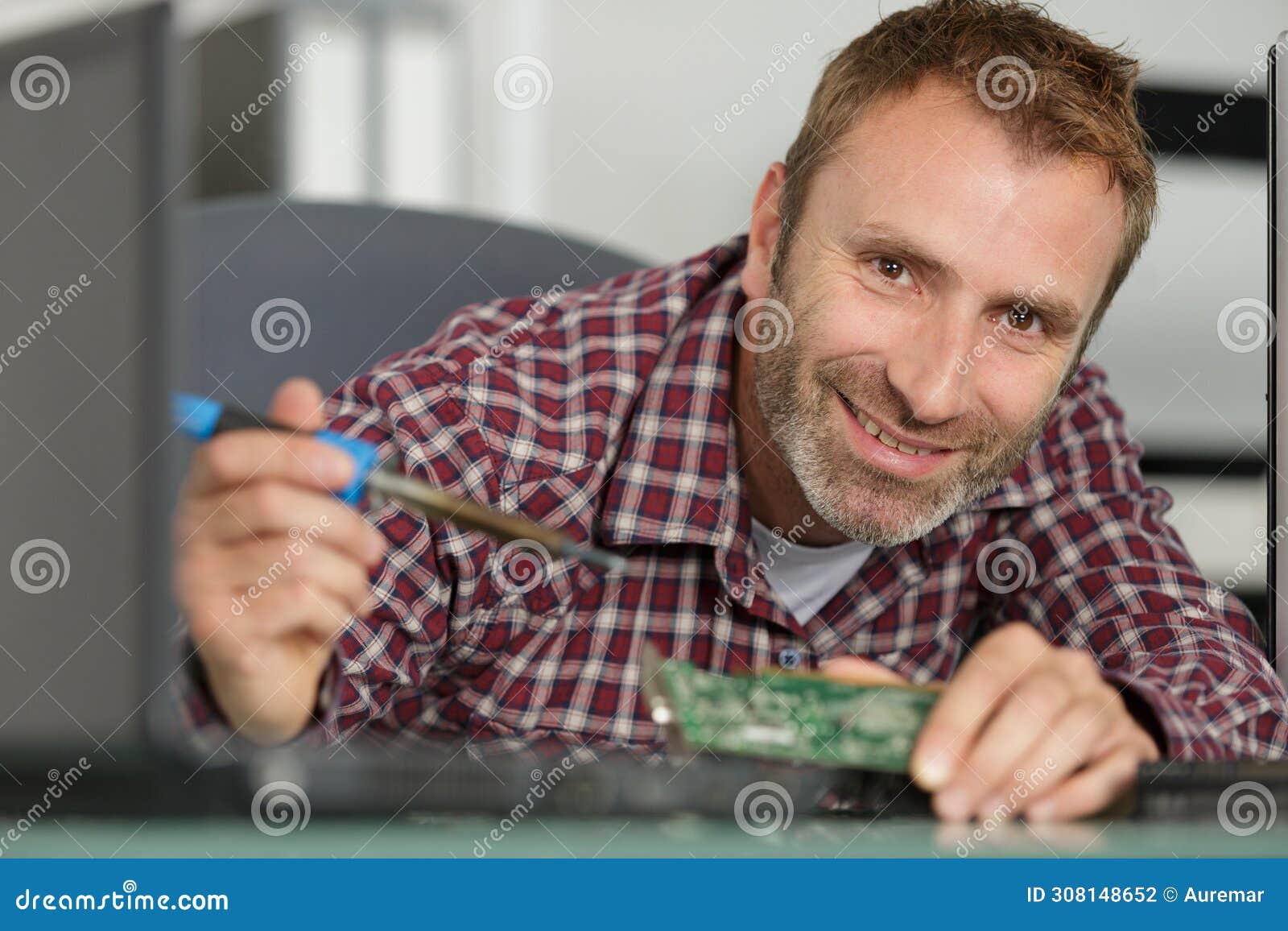 The Electrician Solders The Twisted Electrical Wires In The Socket With ...