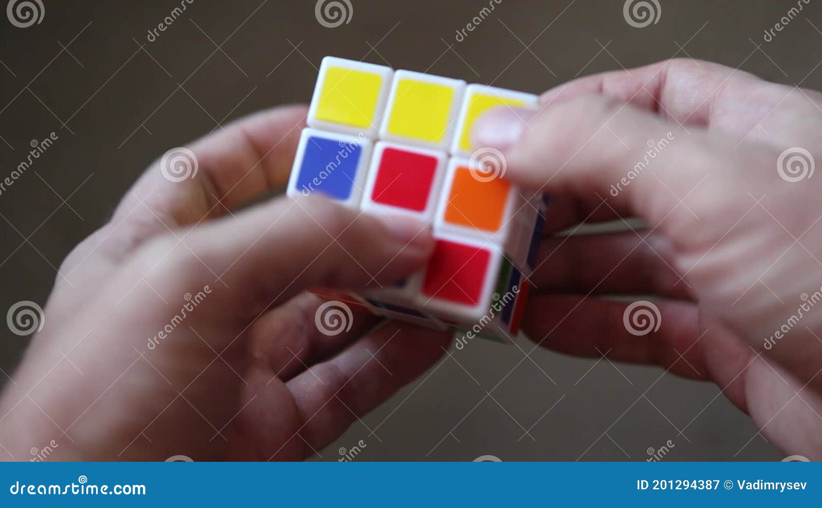 Man Solving Rubik`s Cube. Play with Puzzles in Your Spare Time. Stock ...