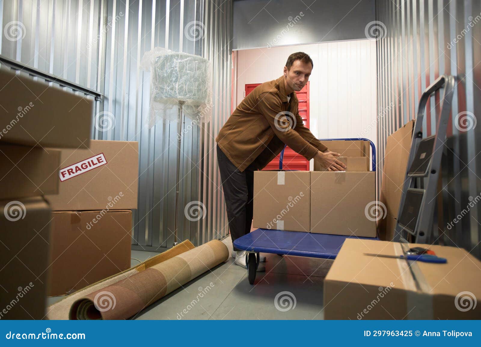 Man Sorting Boxes in Storage Unit Stock Image - Image of rent, male ...