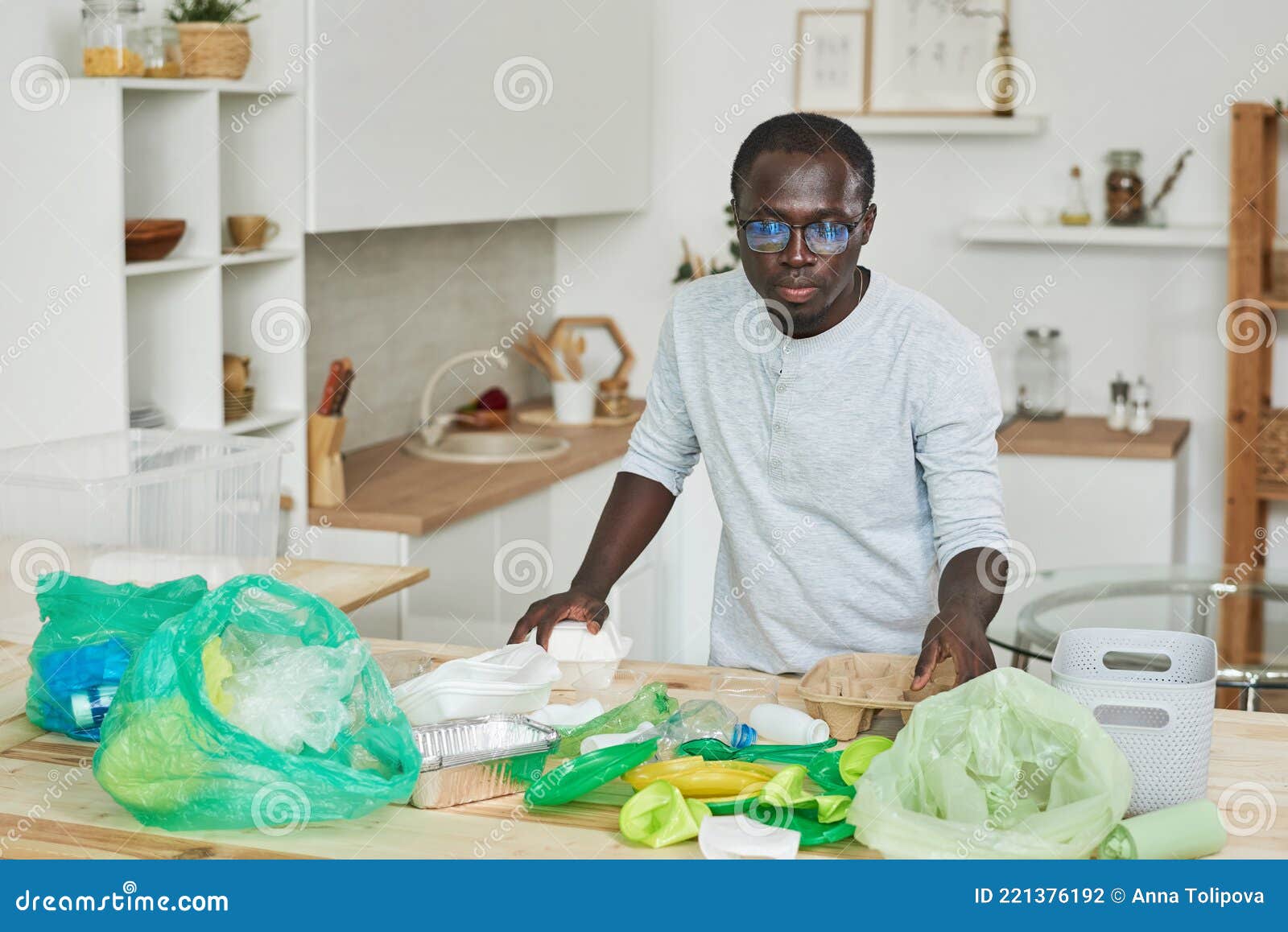 Man sorting the garbage stock photo. Image of adult - 221376192