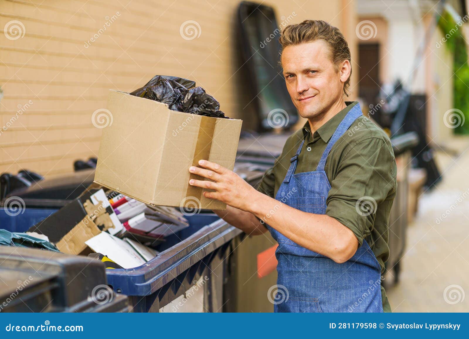 Man Sorting Garbage before Throwing it into Trash Can. Man, Possibly ...