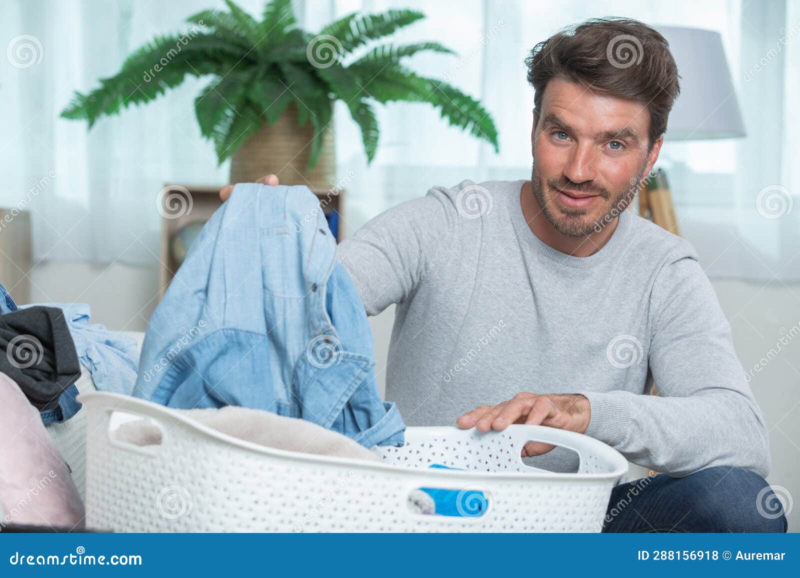 Man Sorting Laundry in Basket Stock Photo - Image of cleanliness, home ...