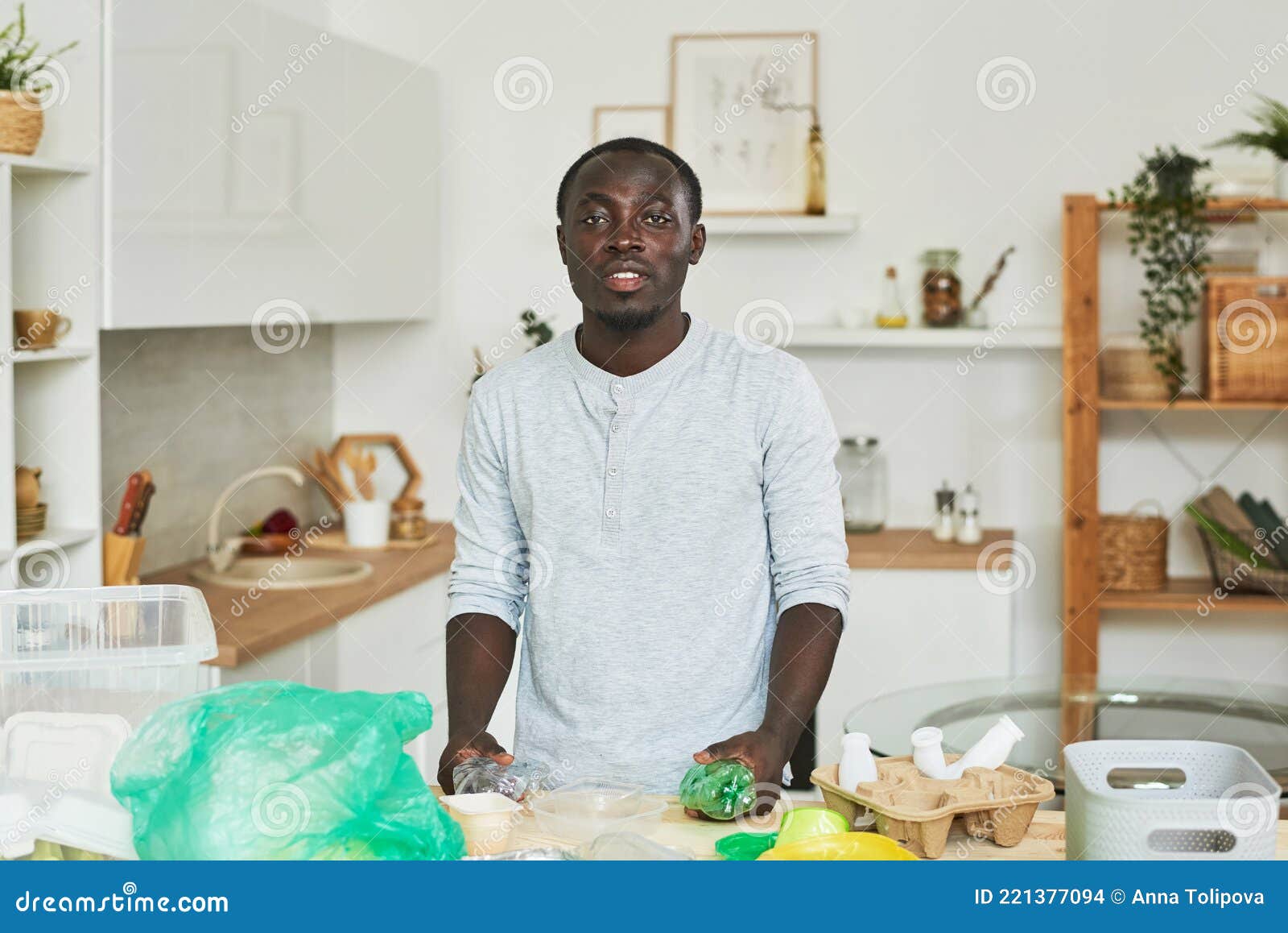 Man sorting the rubbish stock photo. Image of garbage - 221377094