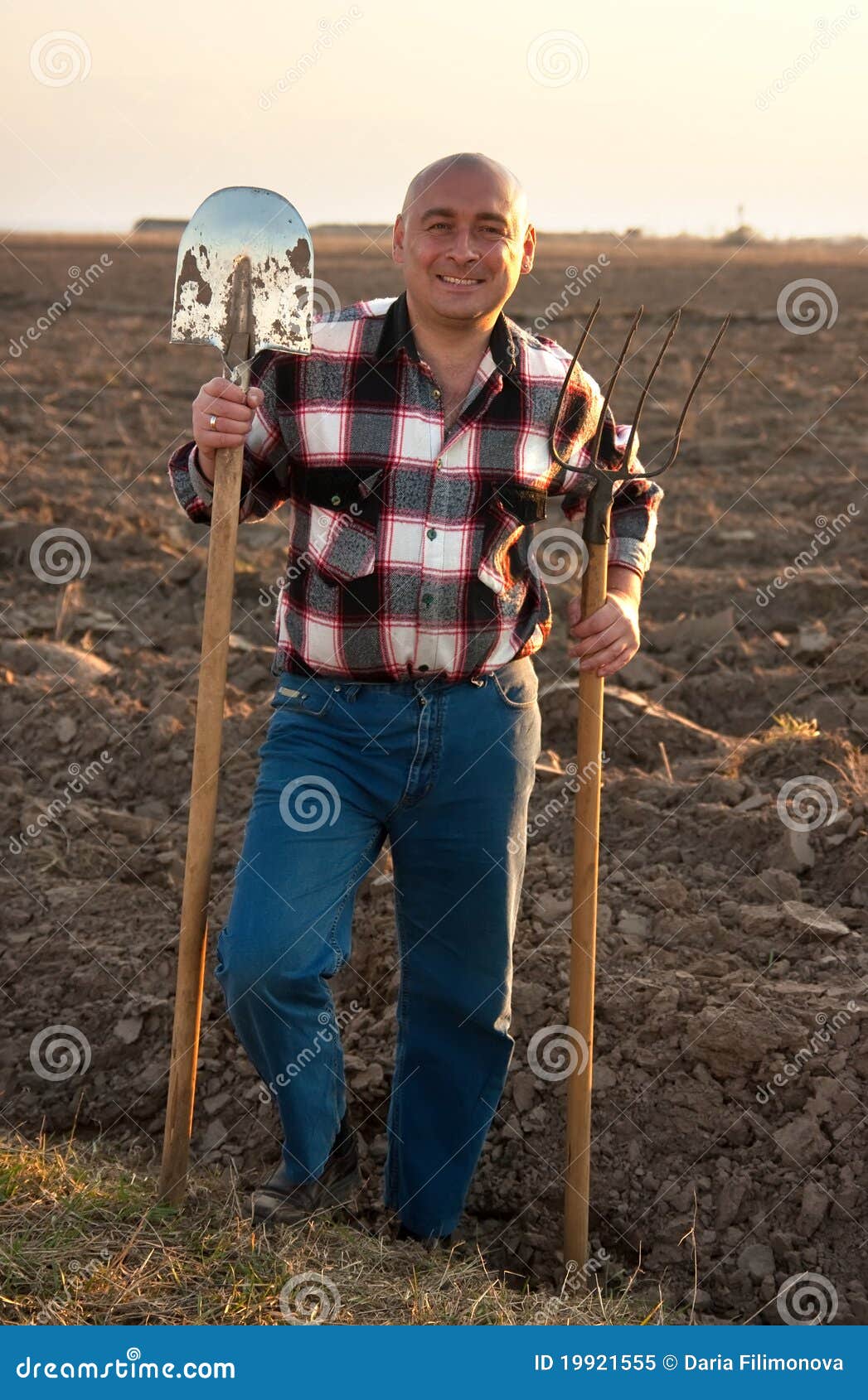 Man with Spade and Pitchfork Stock Image - Image of adult, land: 19921555