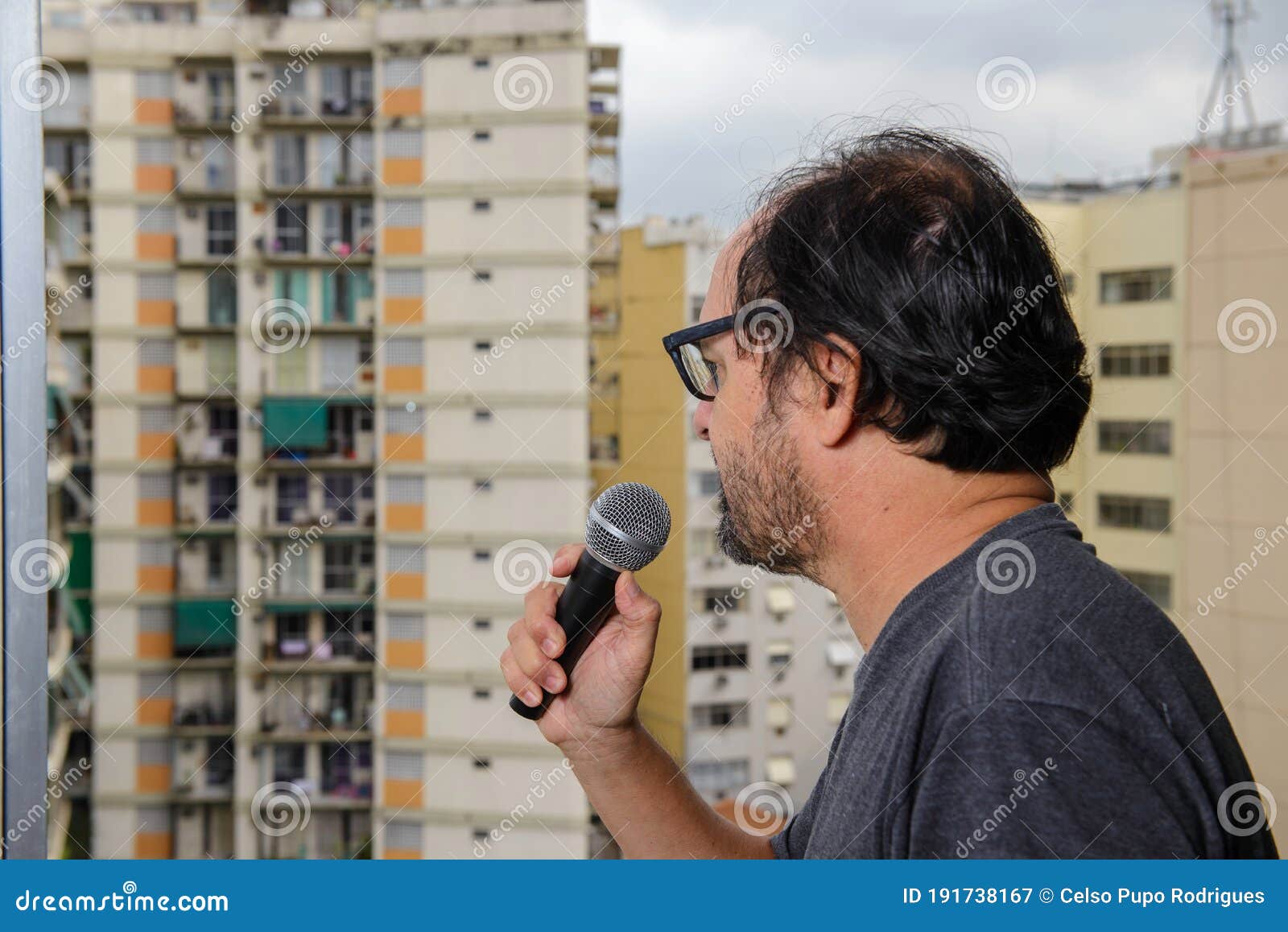 Man Speaking into Microphone Stock Image - Image of professional ...