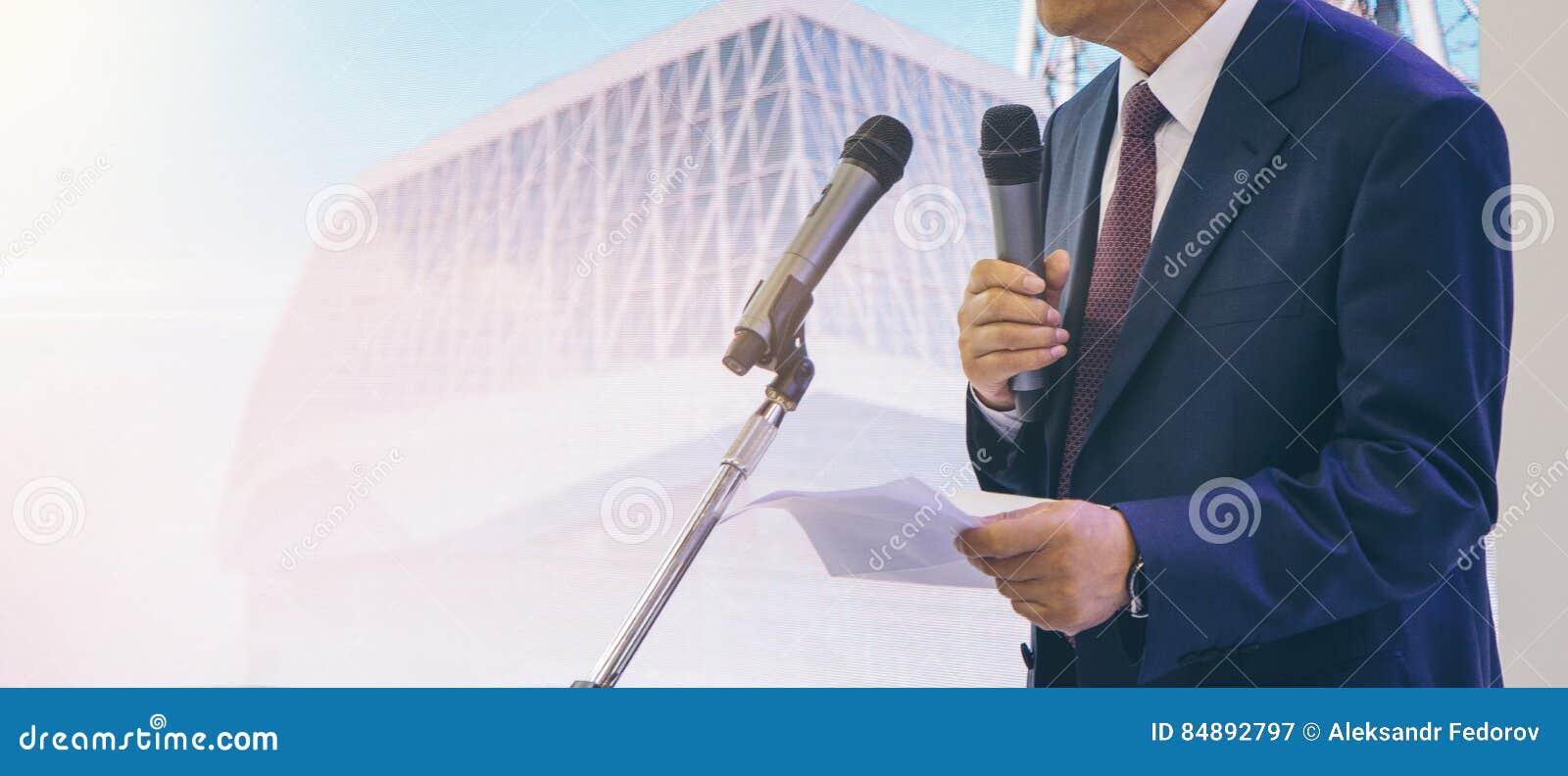 Man Speaks into the Microphone at a Business Meeting Stock Image ...