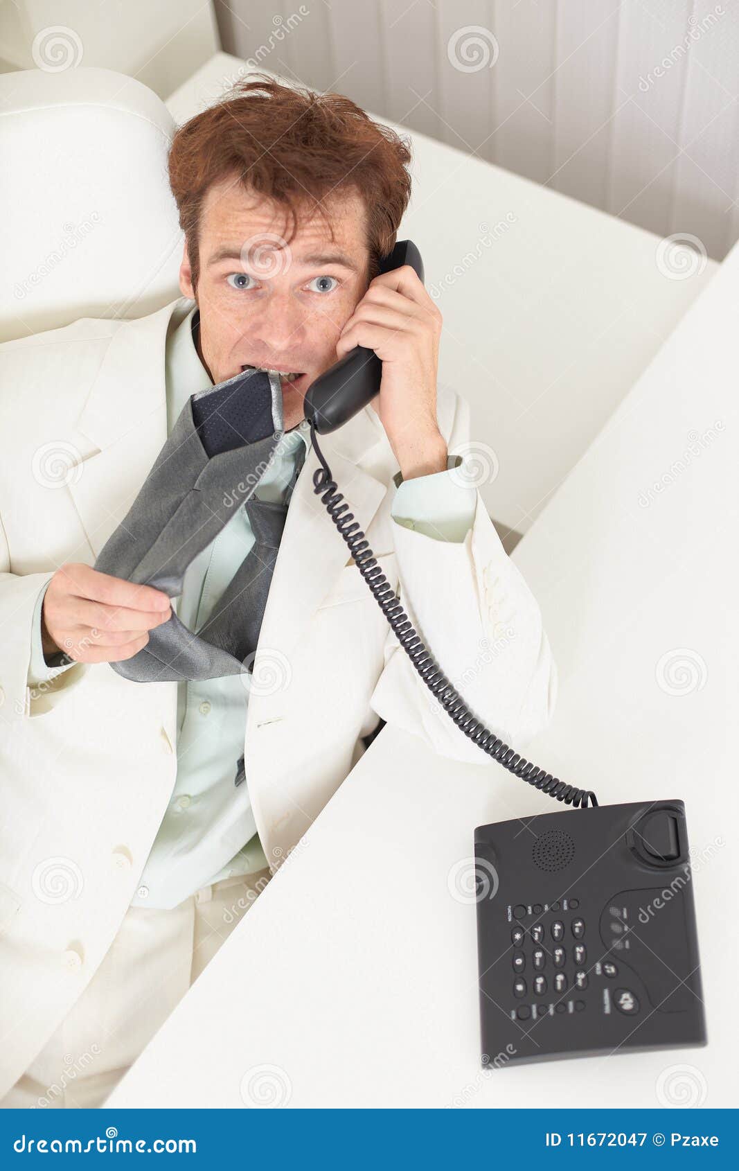 Man Speaks on Phone, Worries and Bites Tie Stock Image - Image of ...