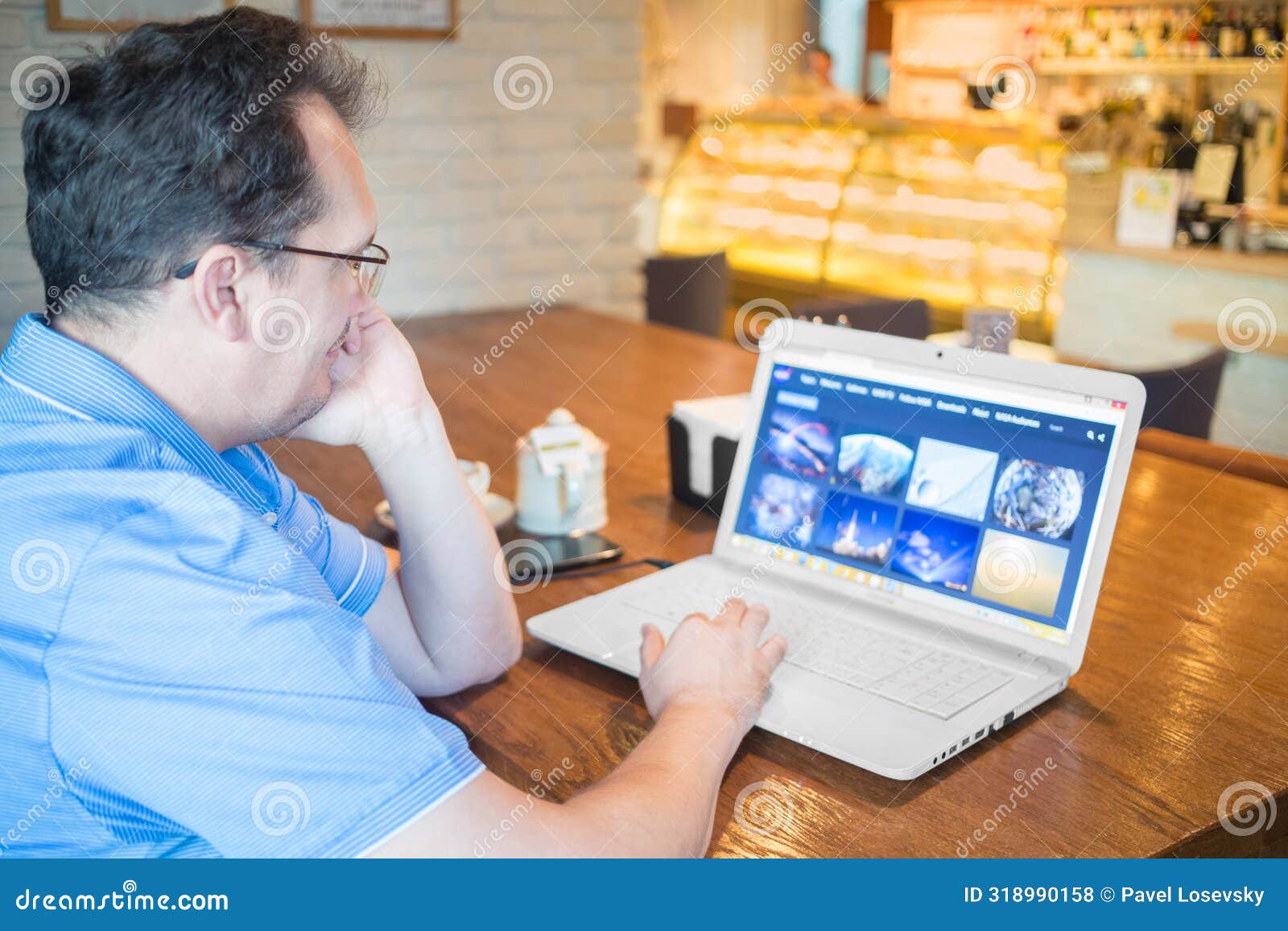 Man Spectacled Looking at His Computer at Stock Photo - Image of ...