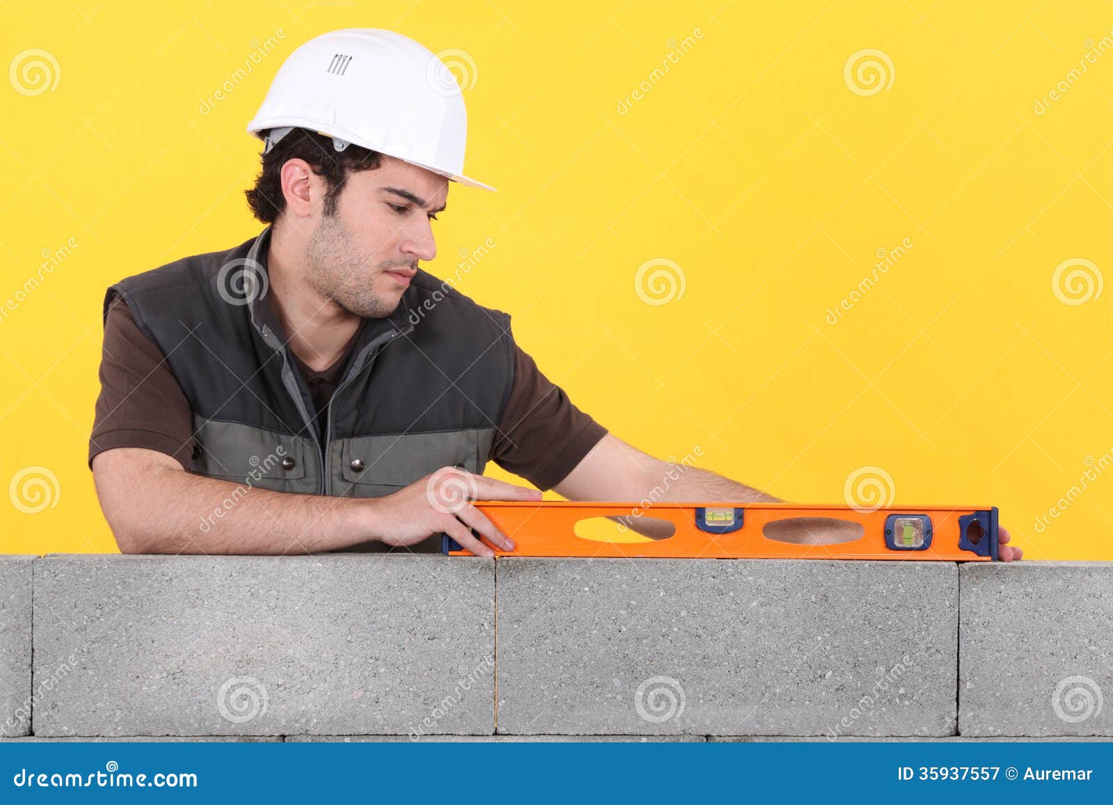 Man with spirit level stock image. Image of manual, concrete - 35937557