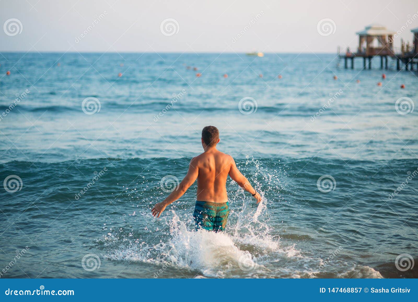 Man Splash Sea Water in the Sea Stock Image - Image of shorts ...