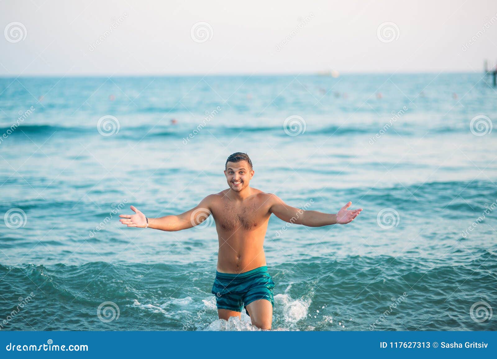 Man splash sea water stock image. Image of outdoor, shorts - 117627313