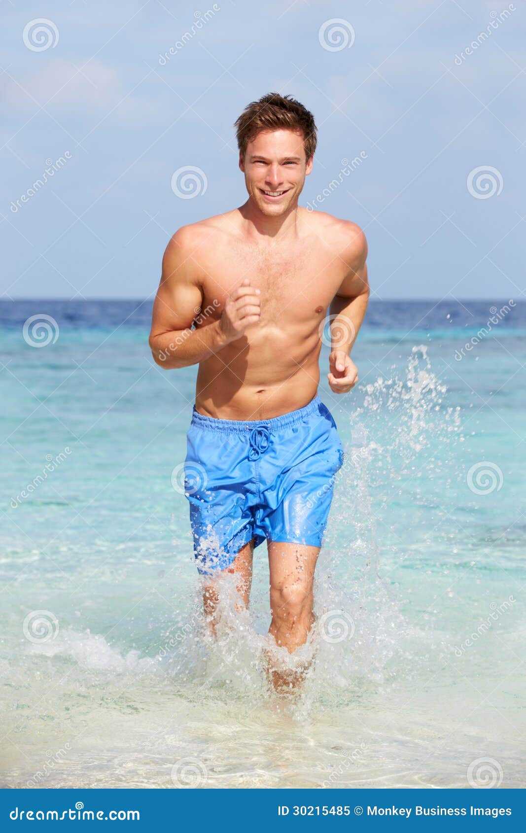 Man Splashing in Beautiful Tropical Sea Stock Image - Image of ocean ...